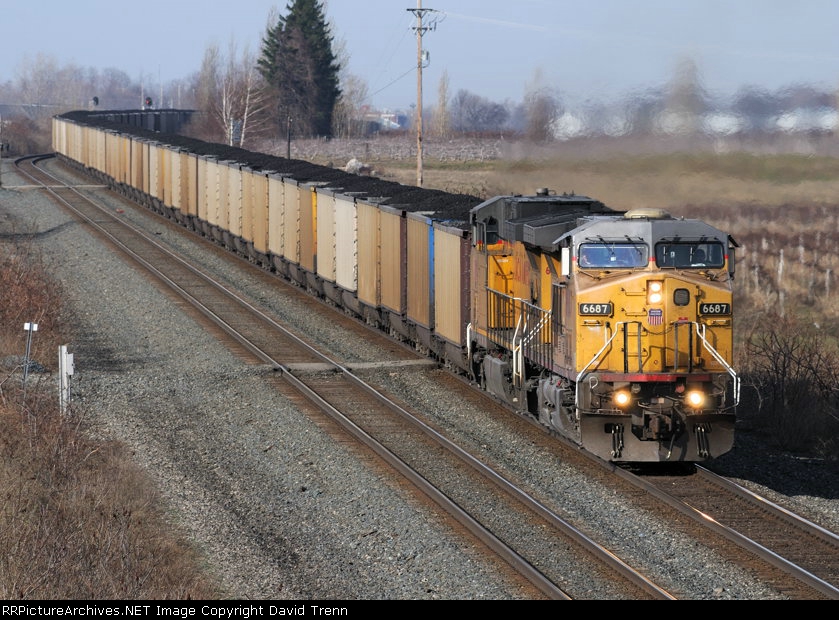 UP 6687 leads Eastbound CSX V771 at MP 70 on track number one.